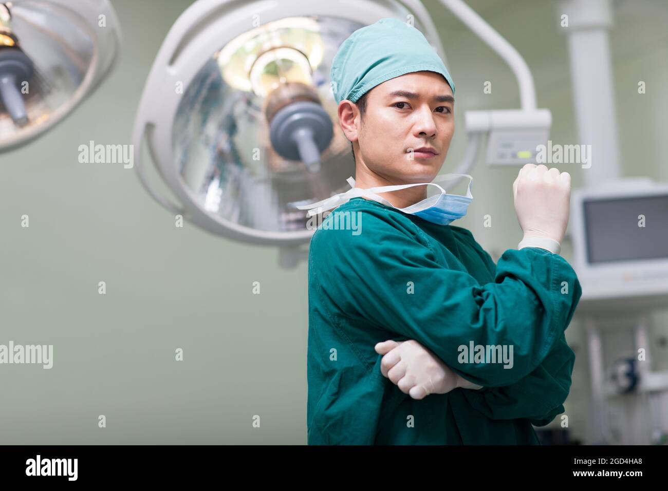 Portrait of surgeon hand on chin Stock Photo - Alamy