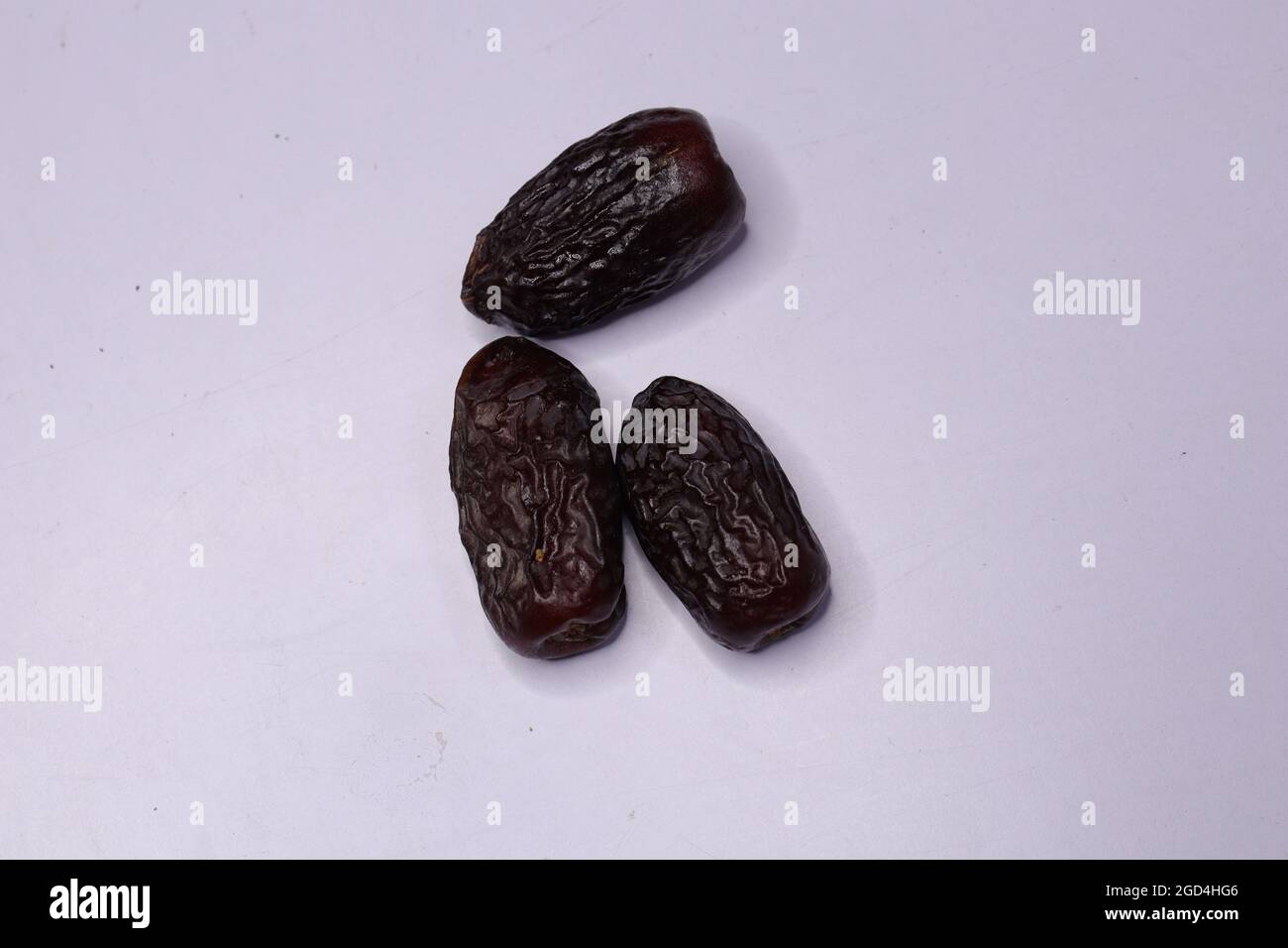 Raw Organic Dates fruit isolated on a white background Stock Photo - Alamy