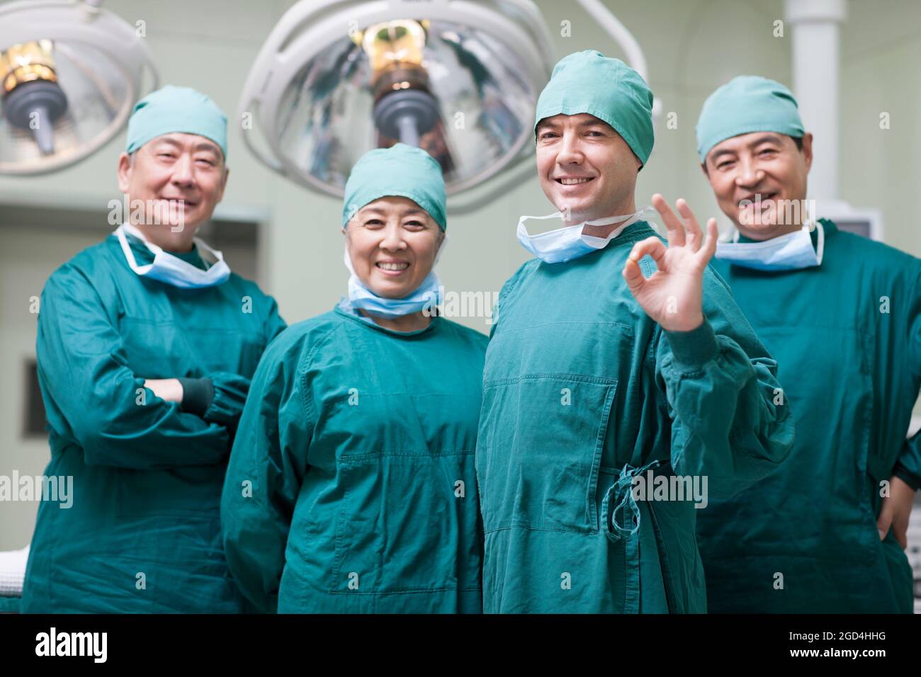 Medical team doing OK sign in operating room Stock Photo - Alamy