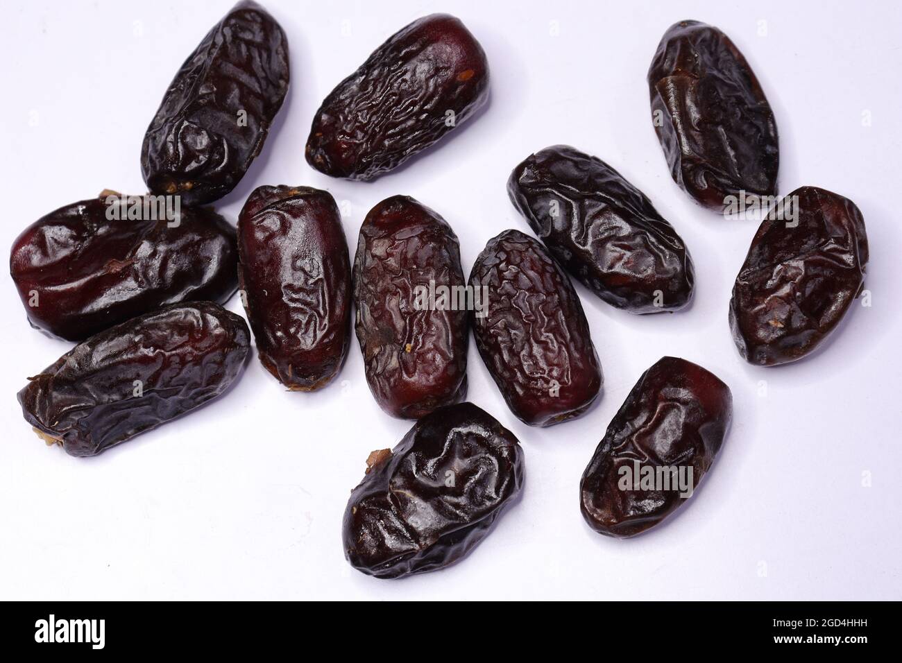 Raw Organic Dates fruit isolated on a white background Stock Photo - Alamy