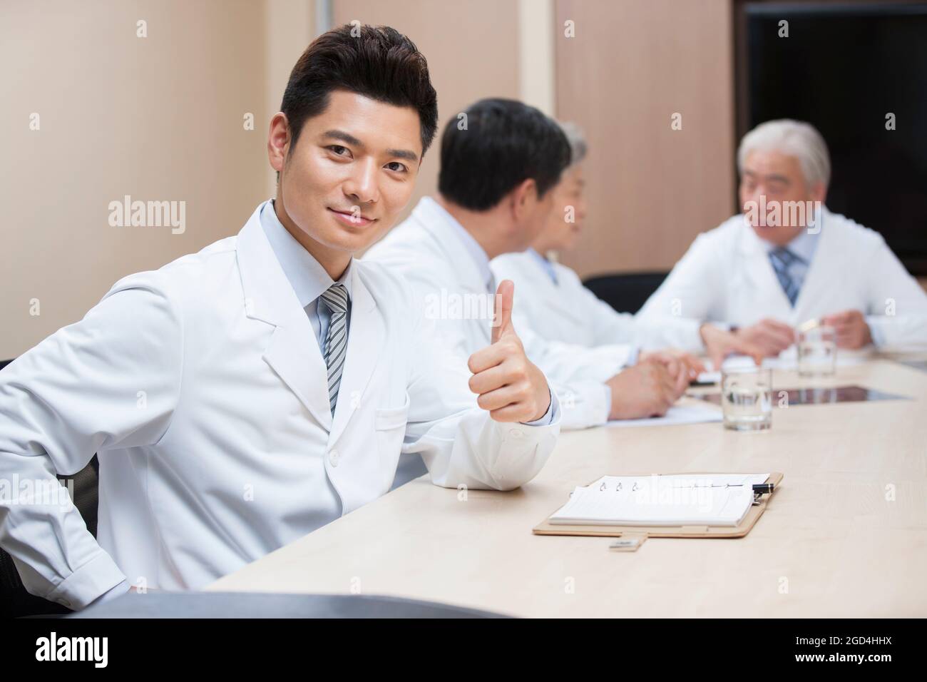 Medical expert doing thumbs up Stock Photo - Alamy