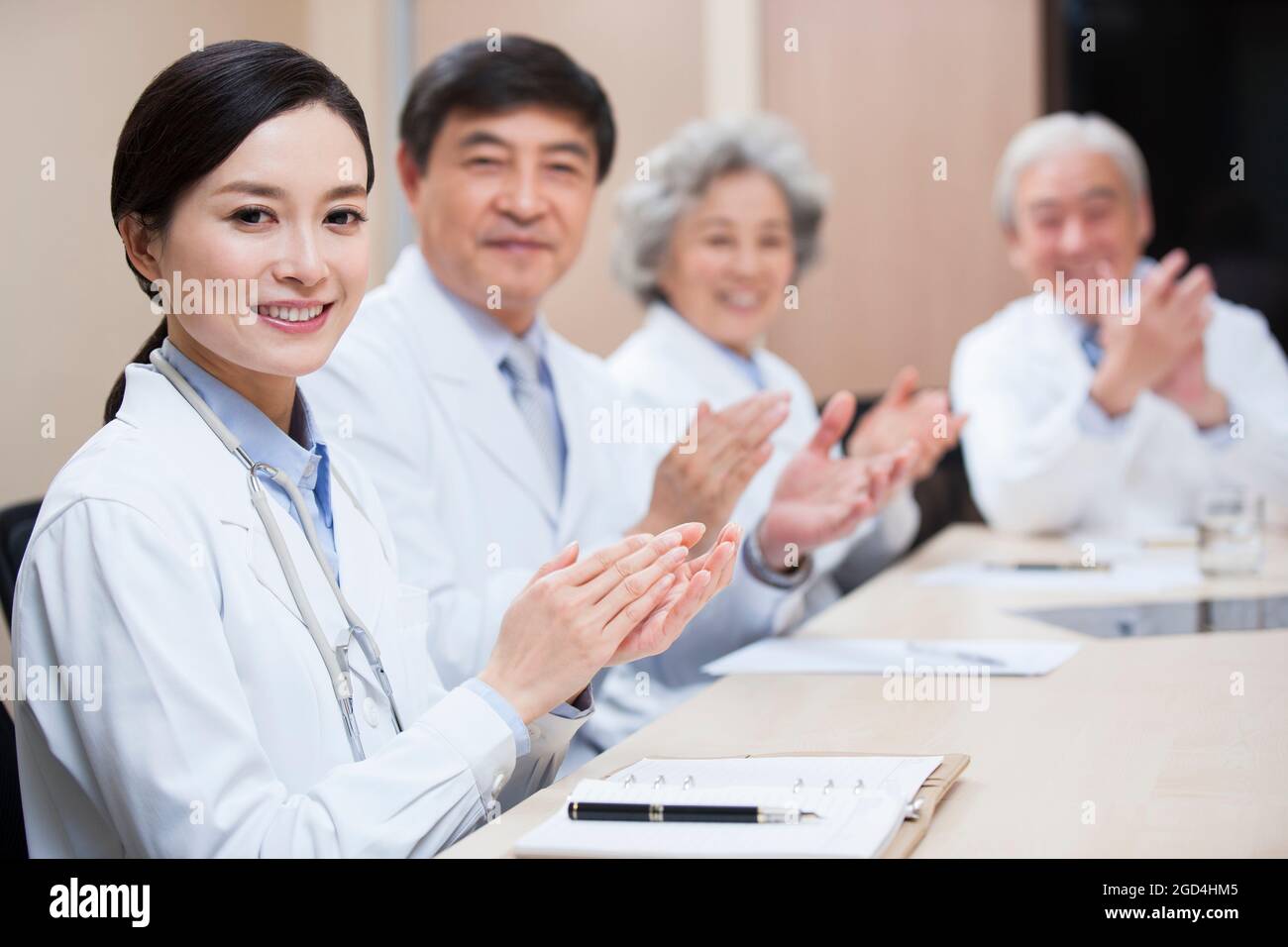 Medical experts clapping Stock Photo - Alamy