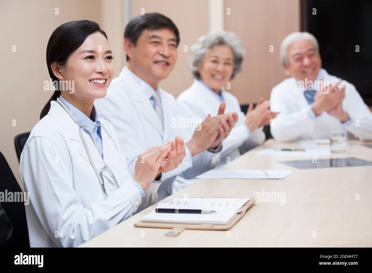 Clapping in meeting room medical hi-res stock photography and images ...