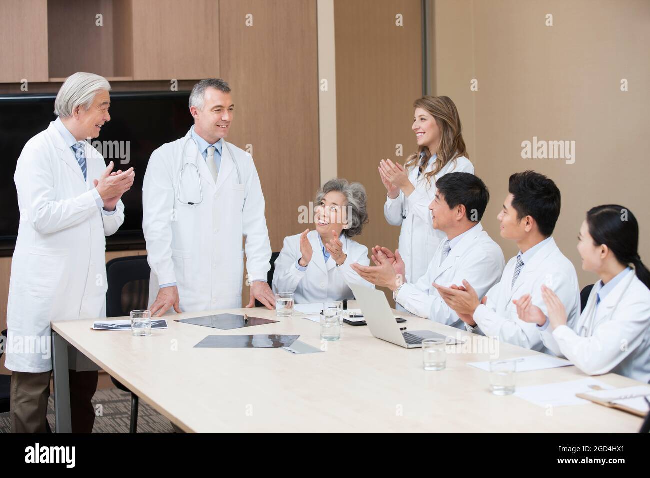 Medical experts clapping Stock Photo - Alamy