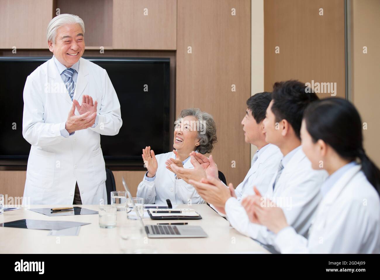 Medical experts clapping Stock Photo - Alamy