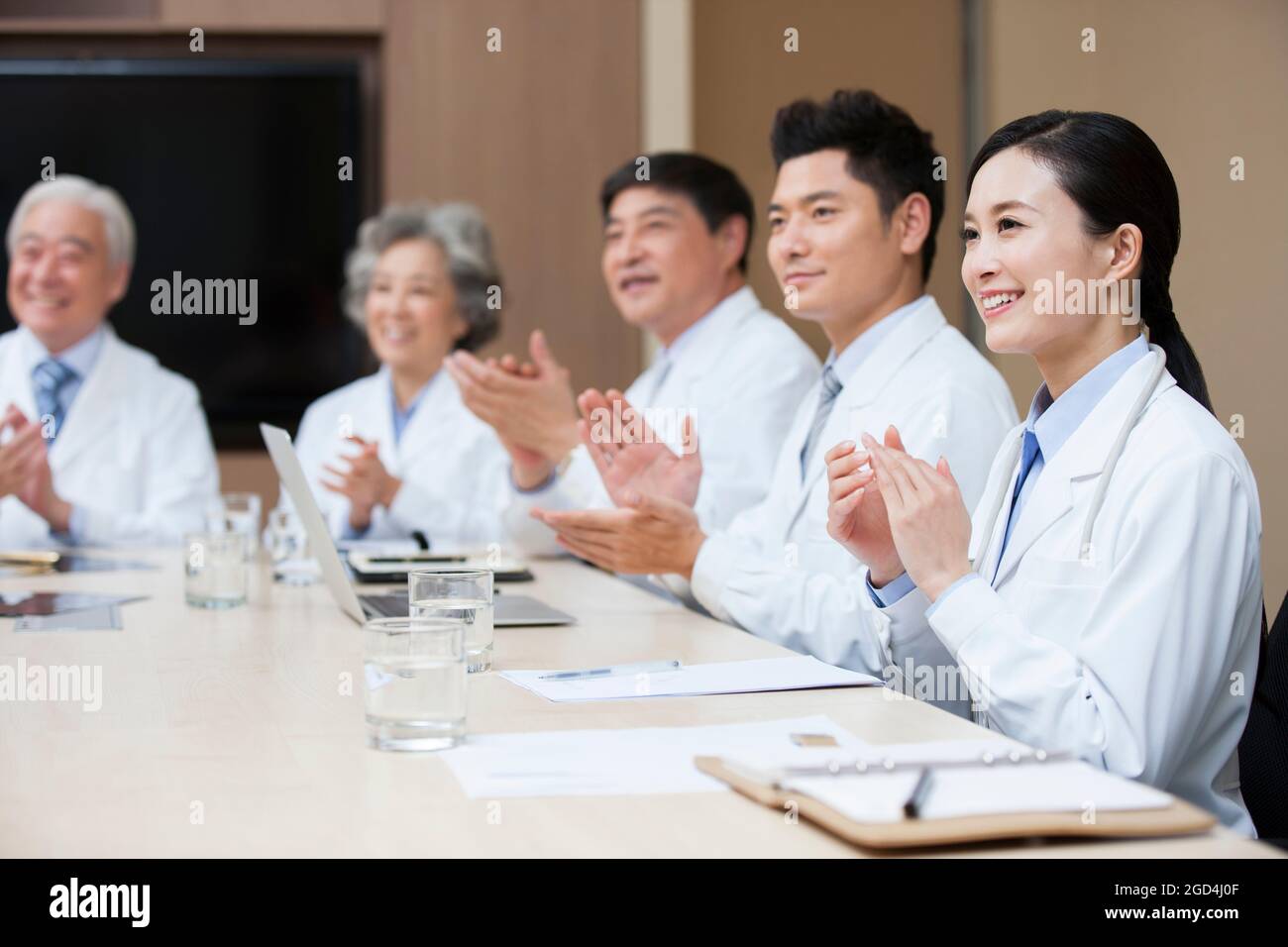 Medical experts clapping Stock Photo - Alamy
