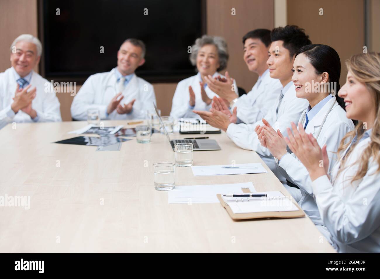 Medical experts clapping Stock Photo - Alamy