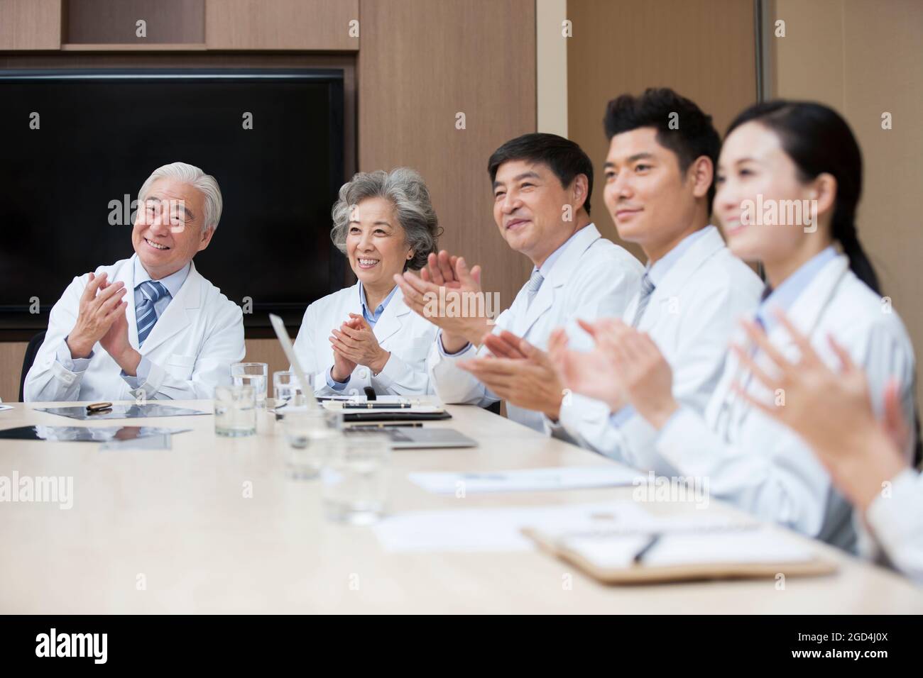 Medical experts clapping Stock Photo - Alamy