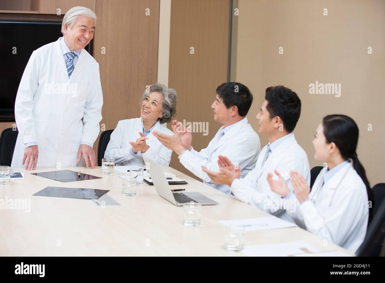 Medical experts clapping Stock Photo - Alamy