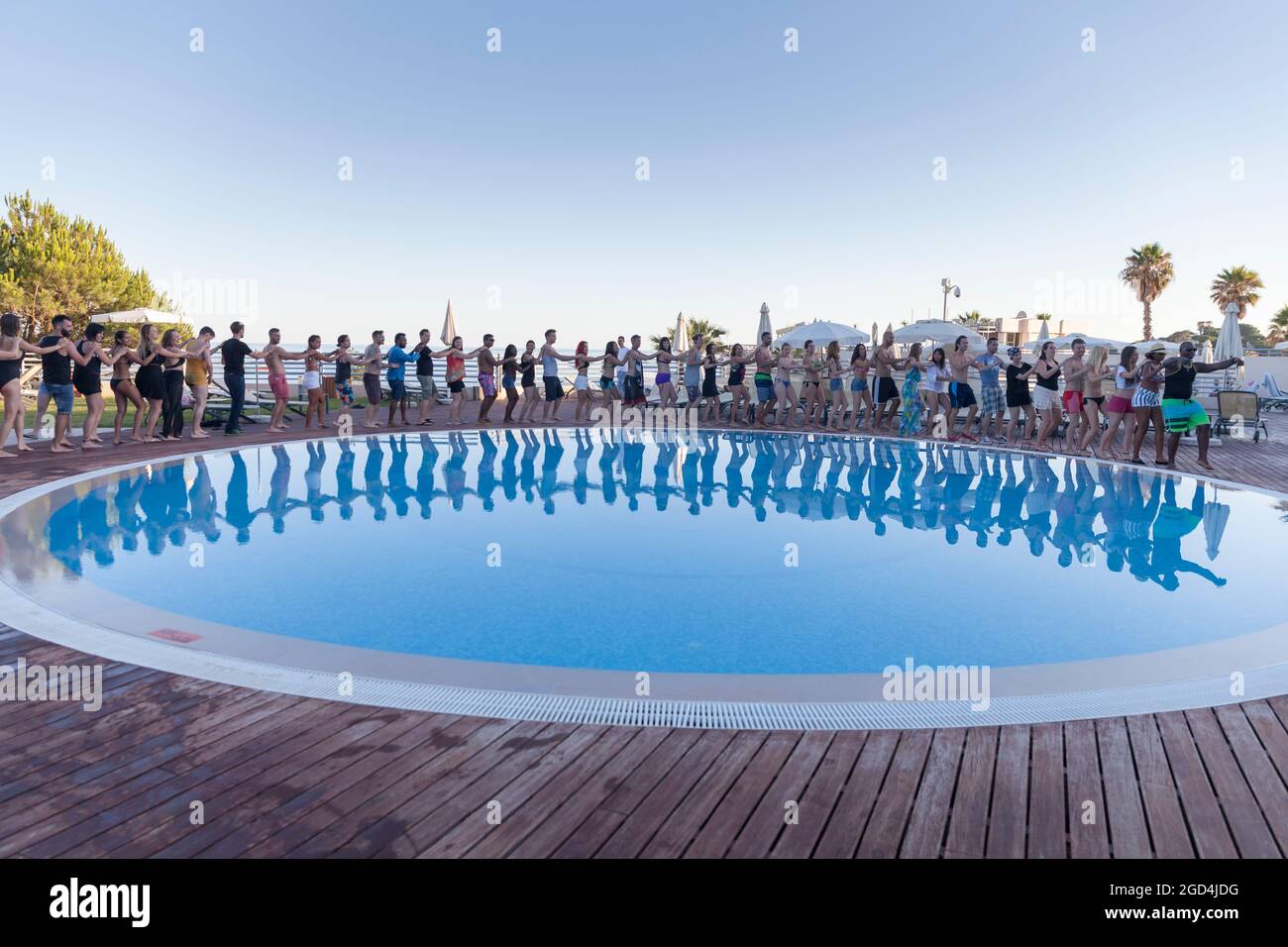 Group 4 people swimming pool hi-res stock photography and images - Alamy