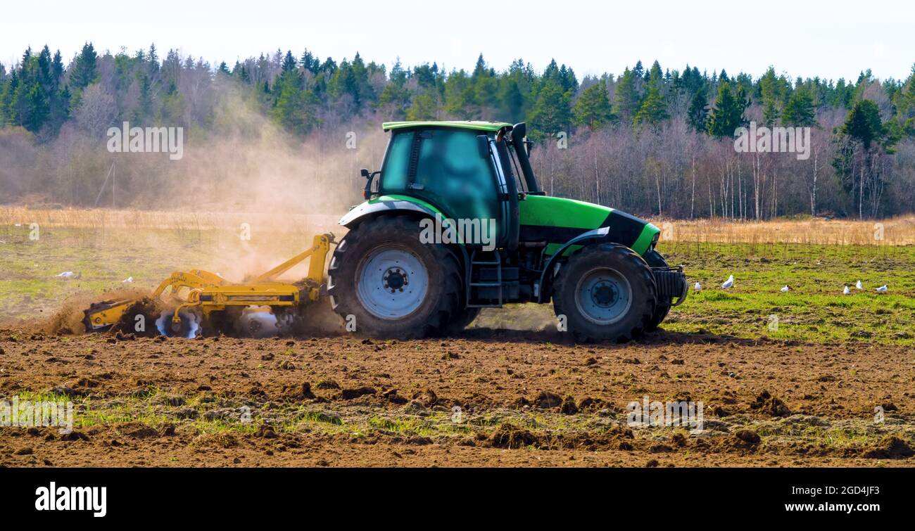 Spring disk plowing of the fallow, cultivation with a disk harrow Stock ...