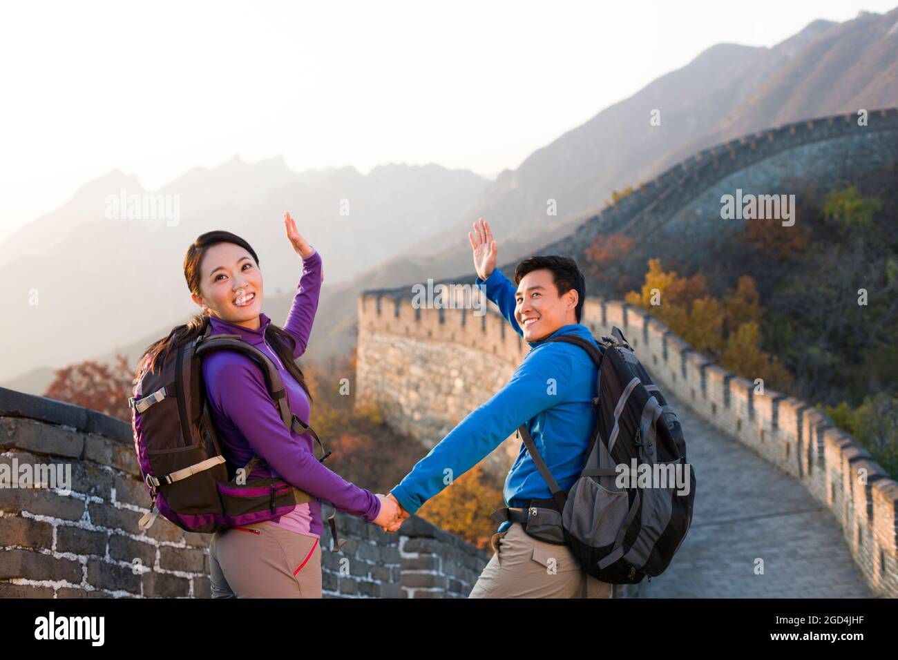 Young couple waving on Great Wall Stock Photo - Alamy