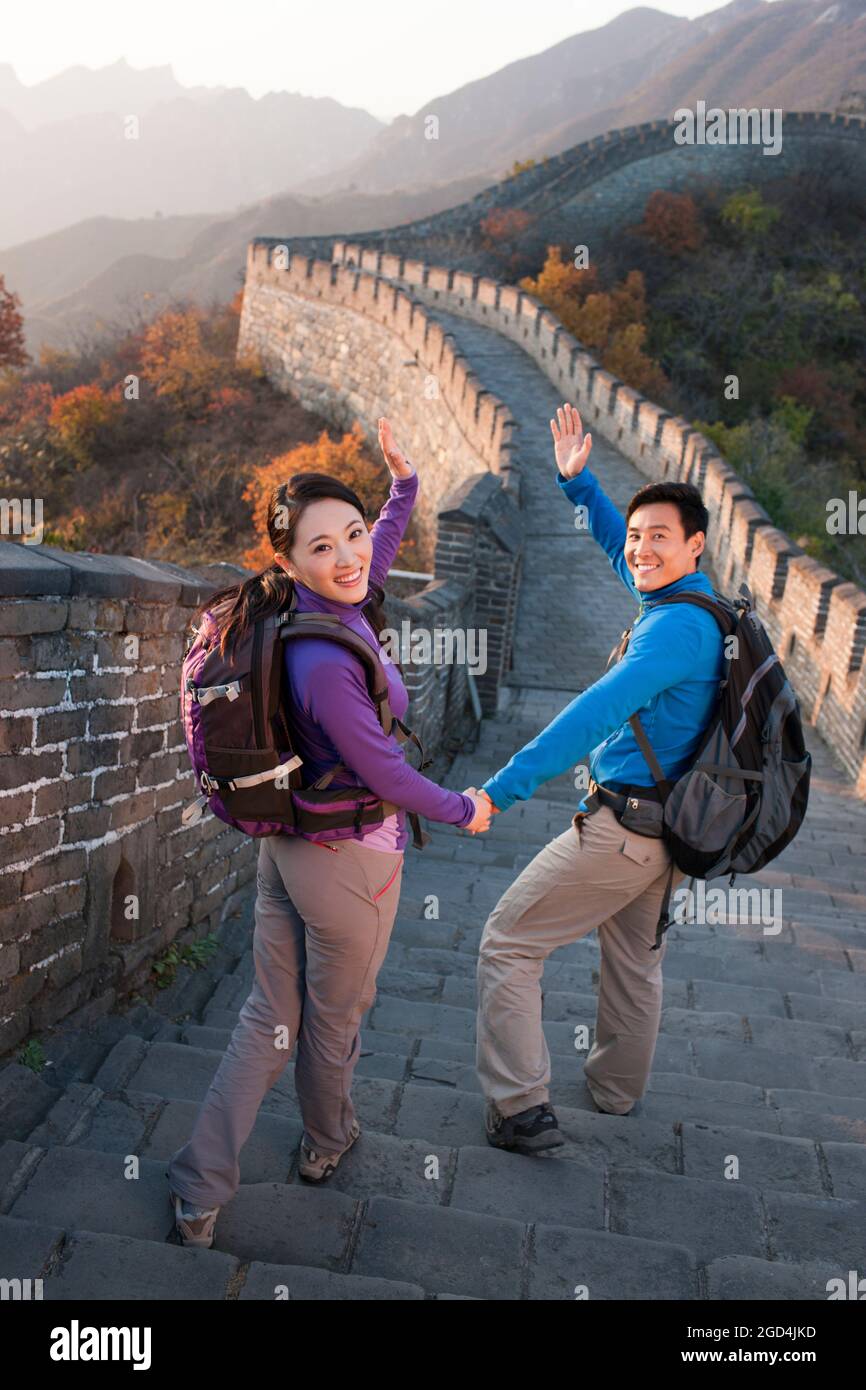 Young couple waving on Great Wall Stock Photo - Alamy