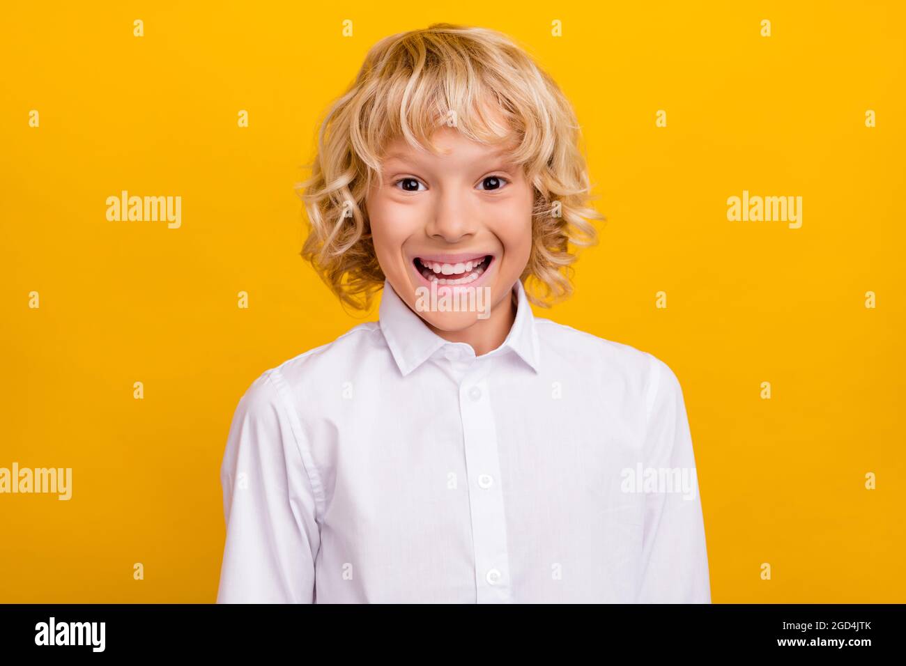 Photo of astonished carefree person beaming smile look camera isolated ...