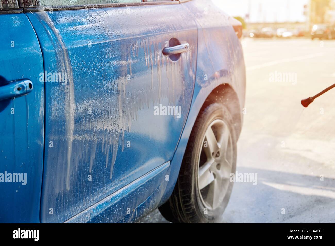 Car washing. Cleaning car with contactless high pressure washing. Self ...