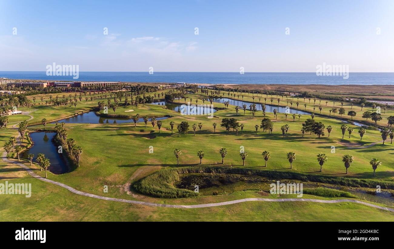 Green golf courses by the sea. Salgados beach. Portugal, Albufeira ...