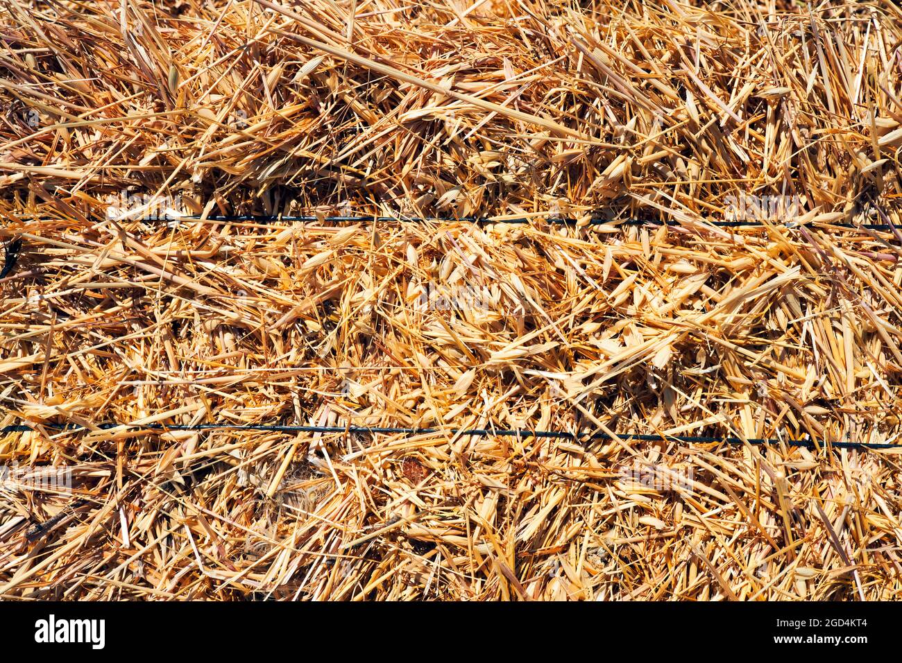 Bale of hay stack on a rural agricultural field. Overhead close up view ...