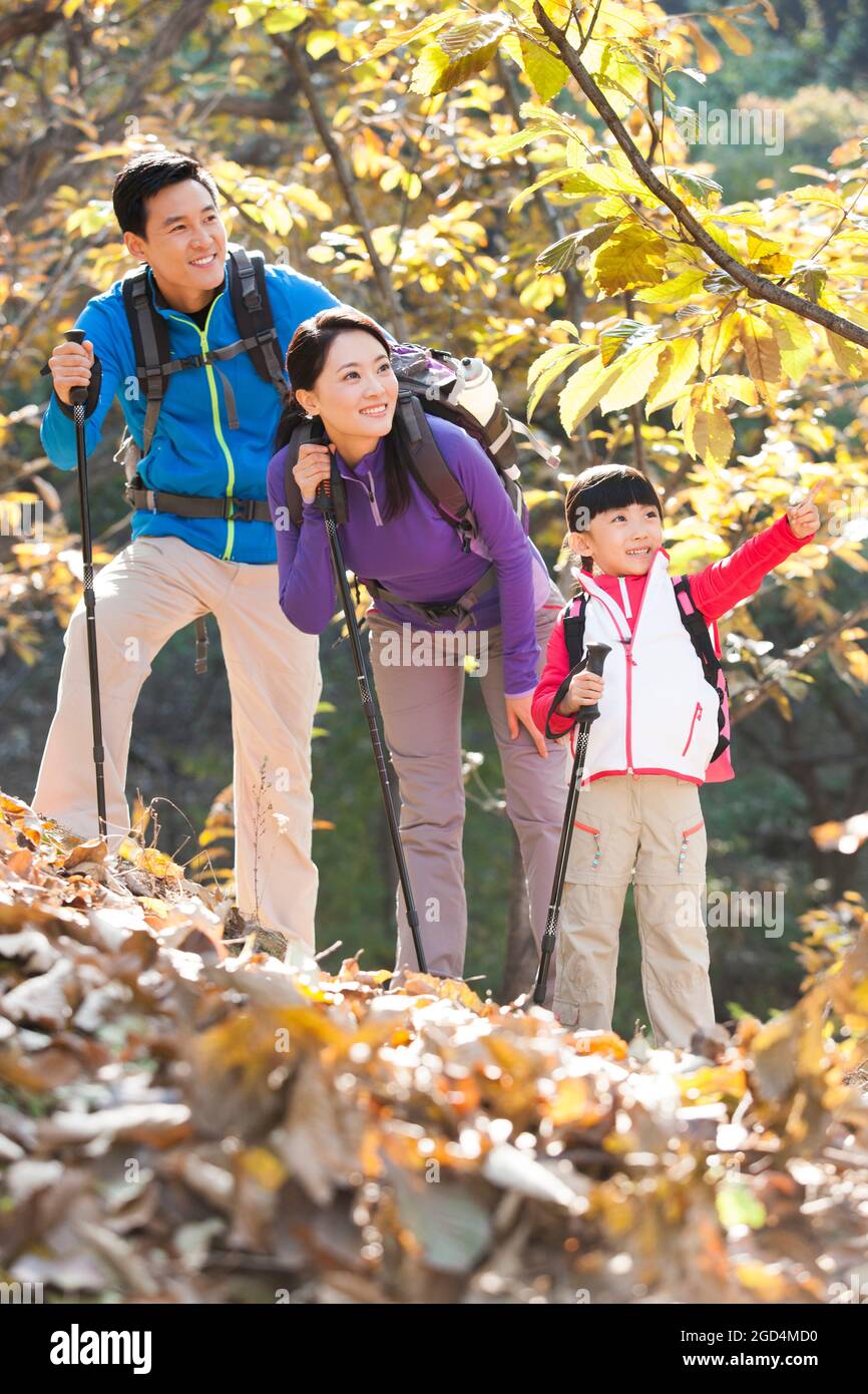 Happy family hiking Stock Photo - Alamy