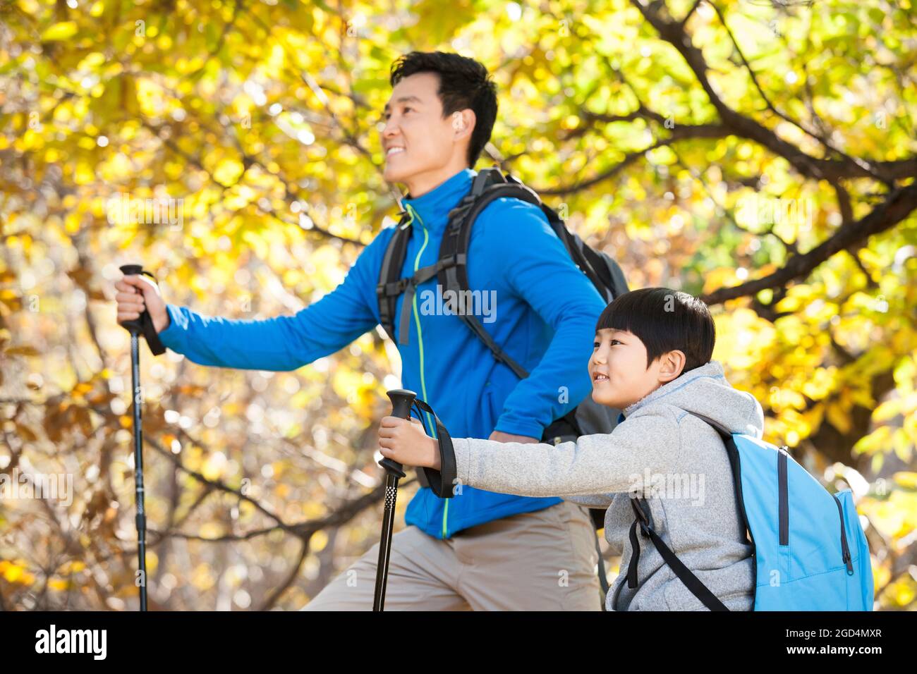 Cheerful father and son hiking Stock Photo - Alamy