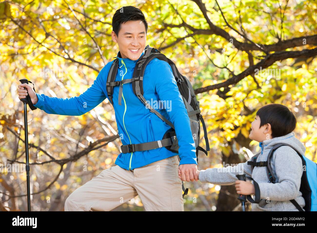 Cheerful father and son hiking Stock Photo - Alamy