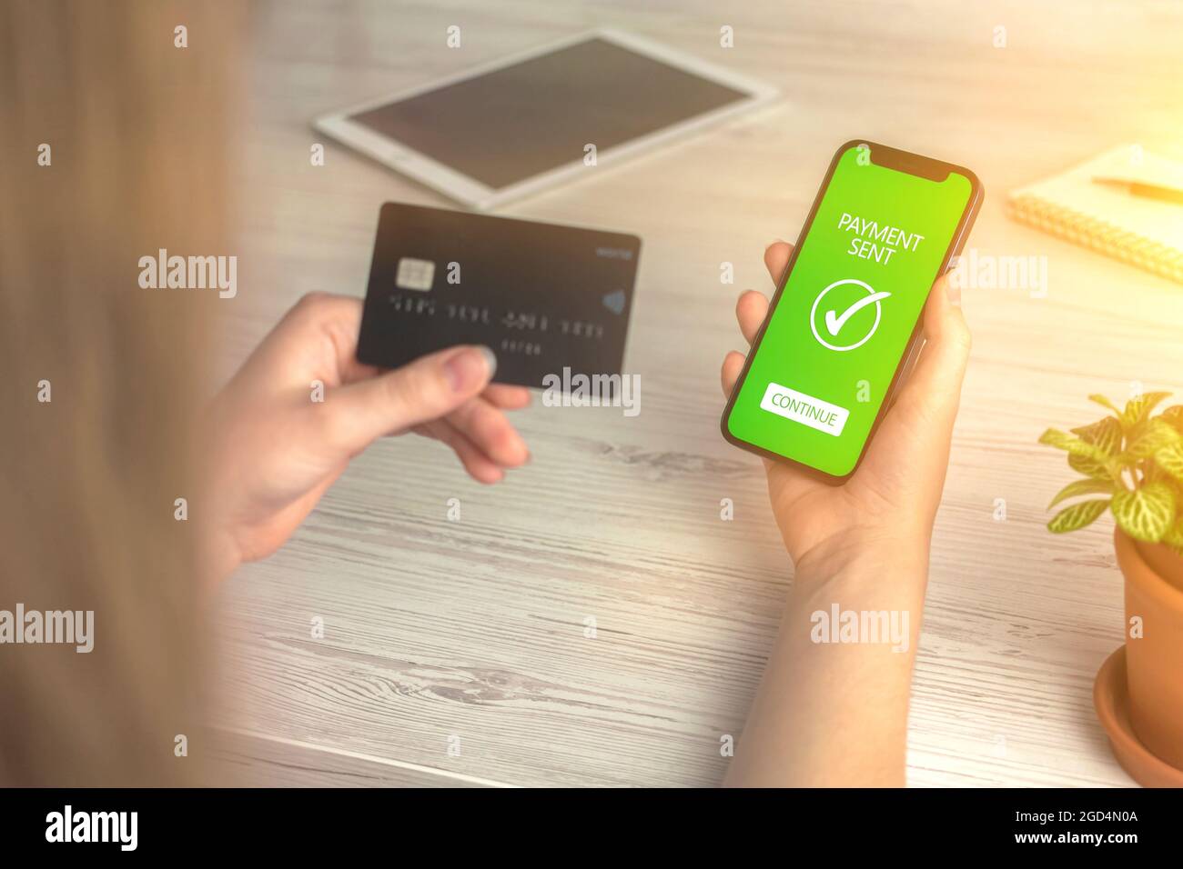 Payment sent screen and credit card in woman hand, online banking and ...