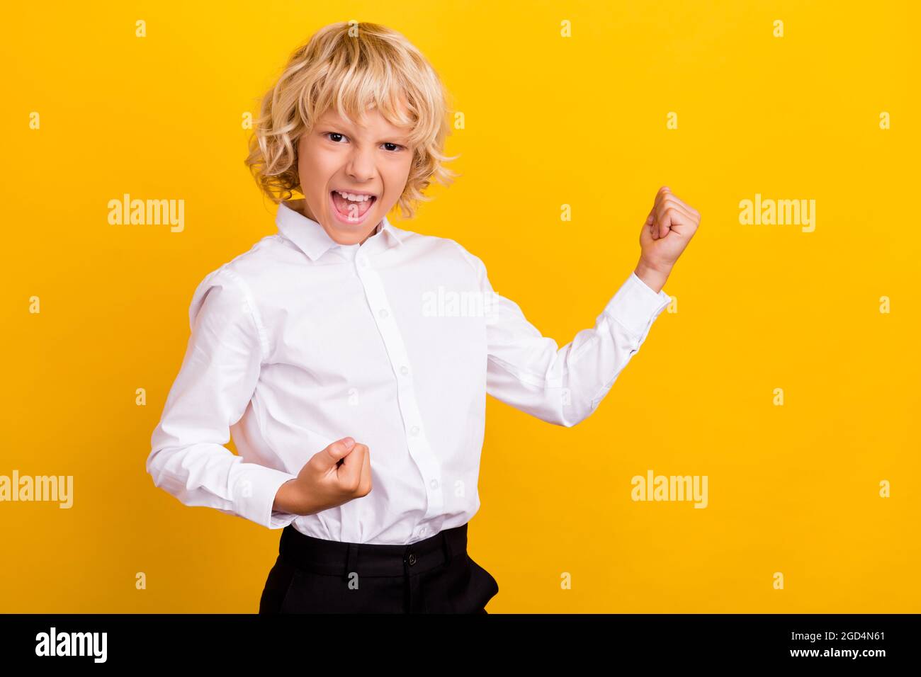 Photo of cheerful schoolboy celebrate victory achievement wear school ...