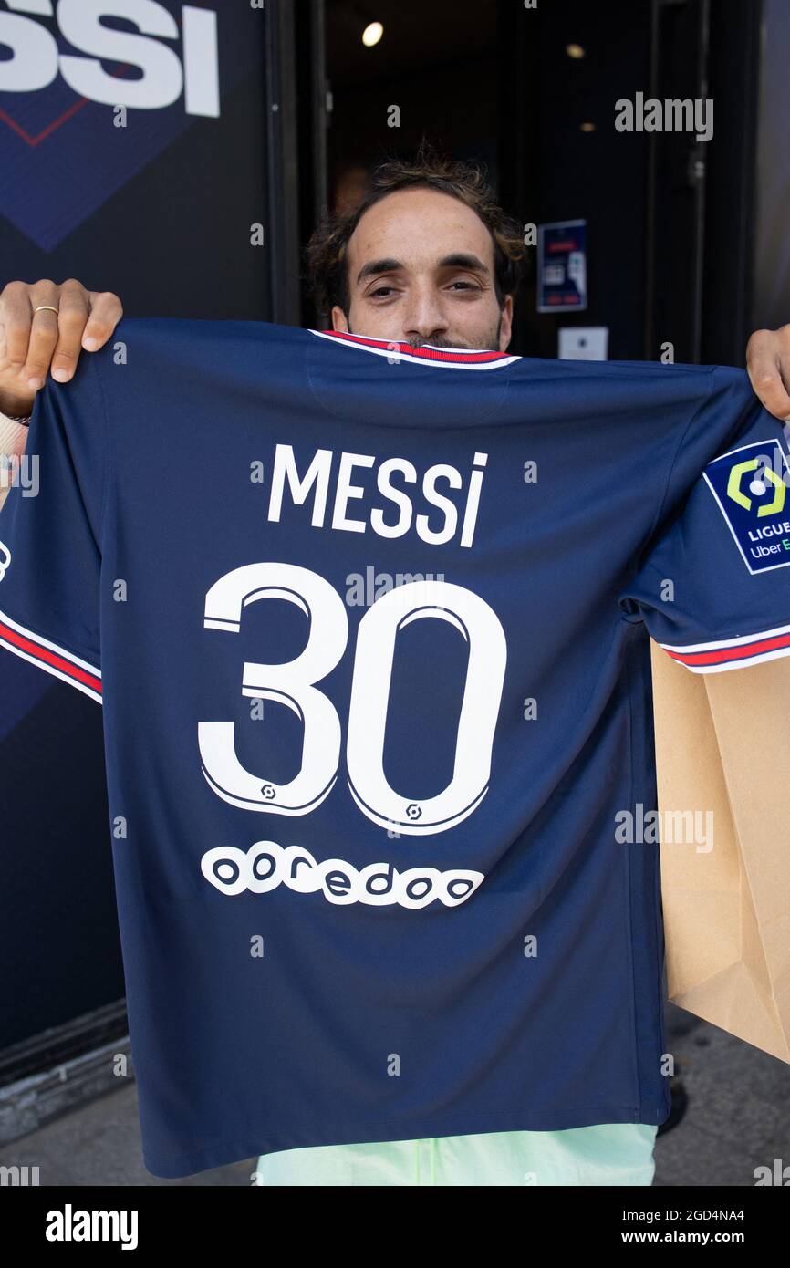 Paris, France. 11th Aug, 2021. A supporter shows a jersey of PSG's ...