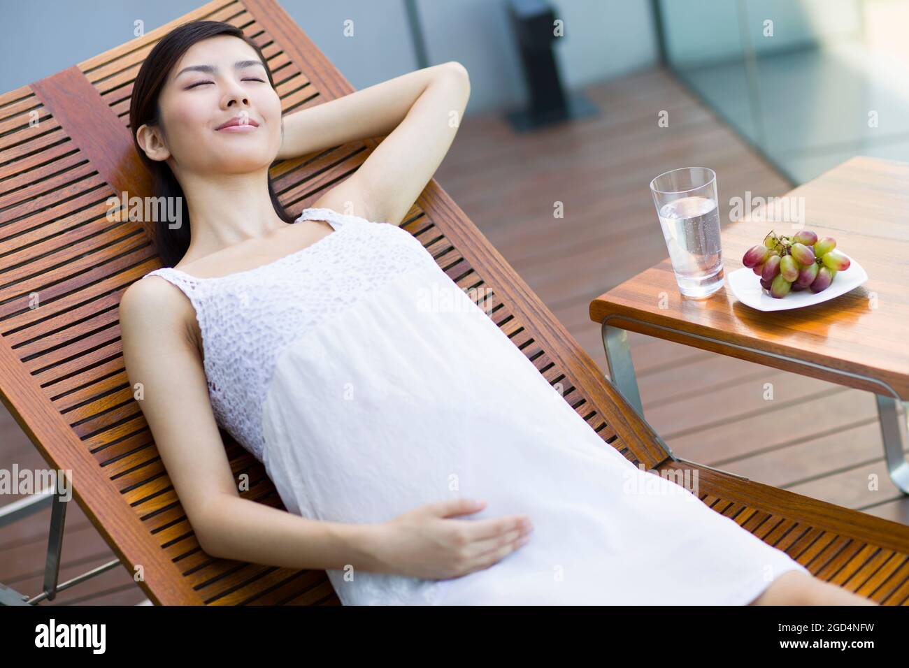 Pregnant woman lying down on back and sleeping hi-res stock photography ...