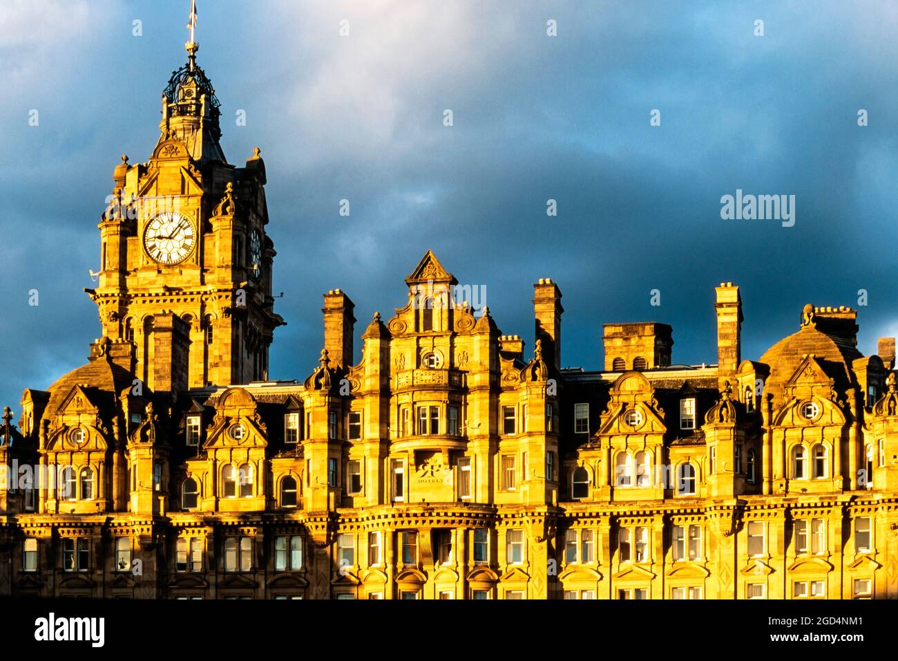 Balmoral hotel clock tower and Edinburgh skyline near sunset, Scotland ...