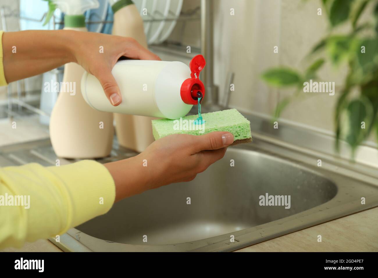 Concept of dishwashing on kitchen basin background Stock Photo - Alamy