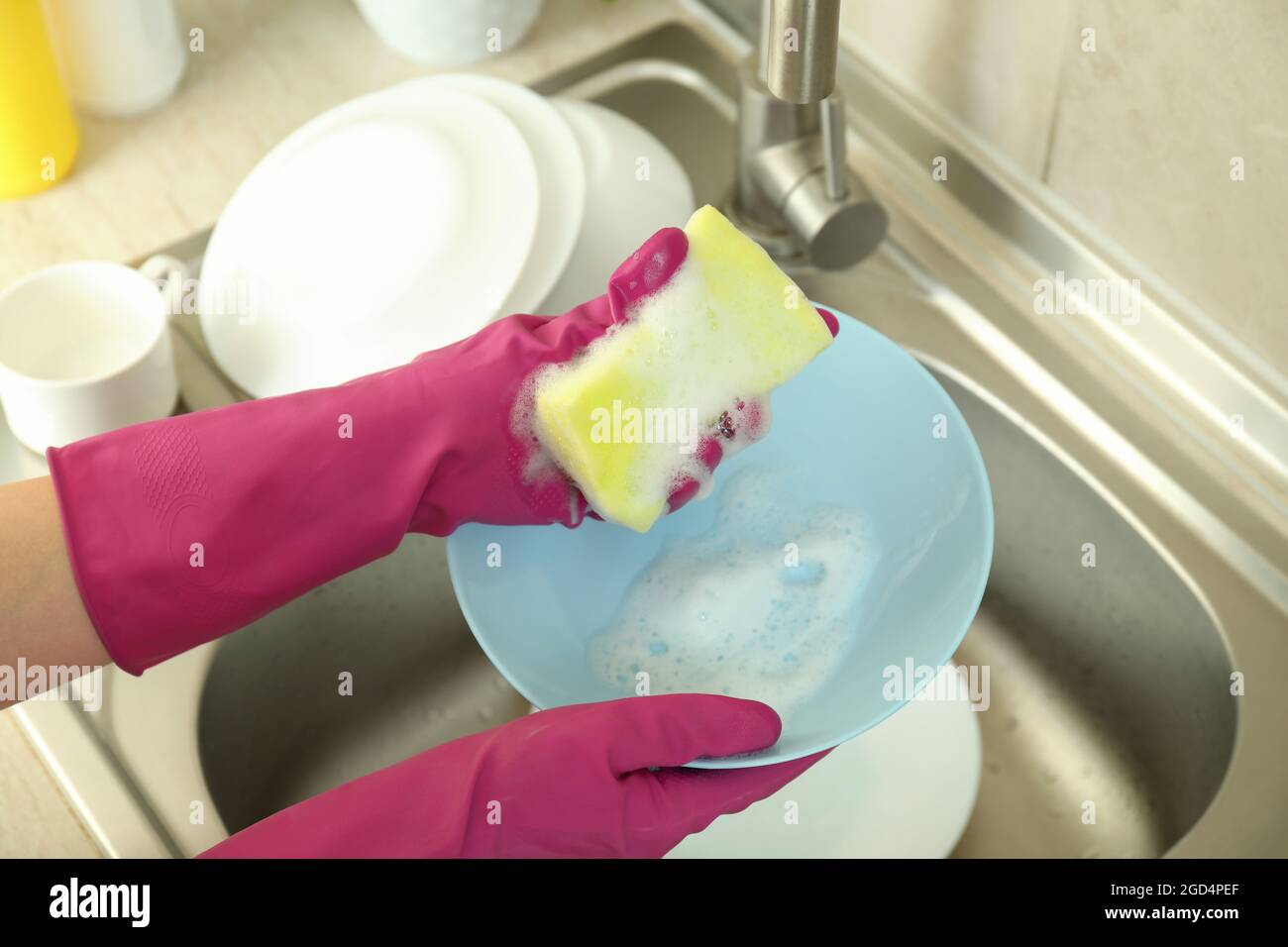 Concept of dishwashing on kitchen basin background Stock Photo - Alamy
