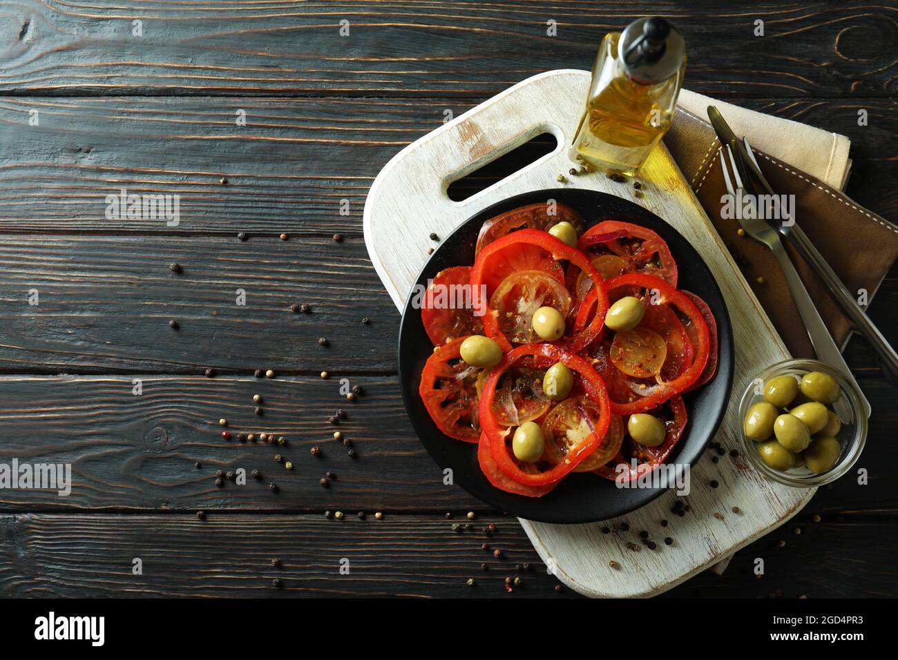 Concept of tasty food with tomato carpaccio on rustic wooden table ...