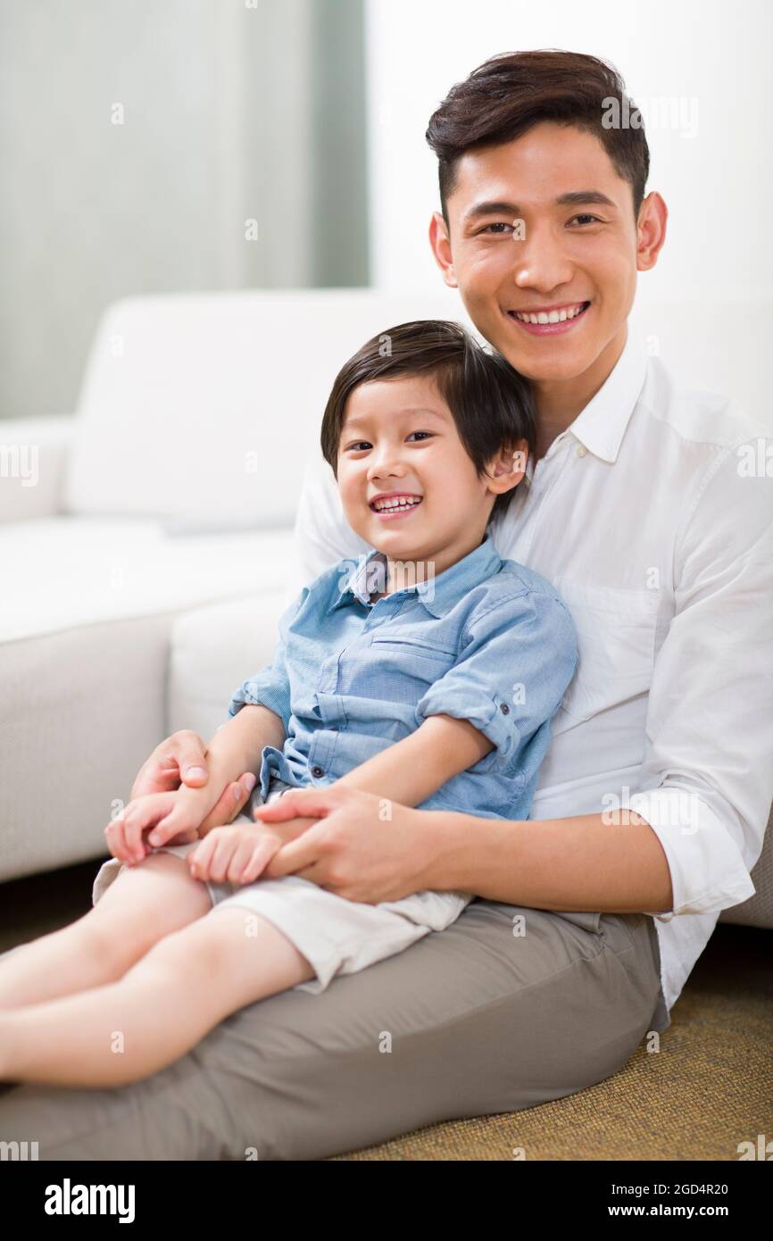 Father and son in living room Stock Photo - Alamy