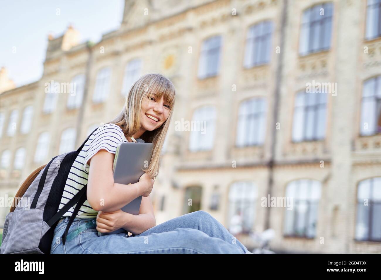 Cute blonde female university student or education concept. Attractive ...
