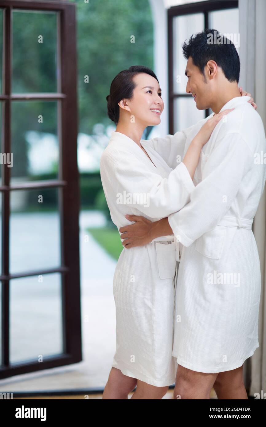 Loving couple in bathrobes embracing in a luxury hotel Stock Photo - Alamy
