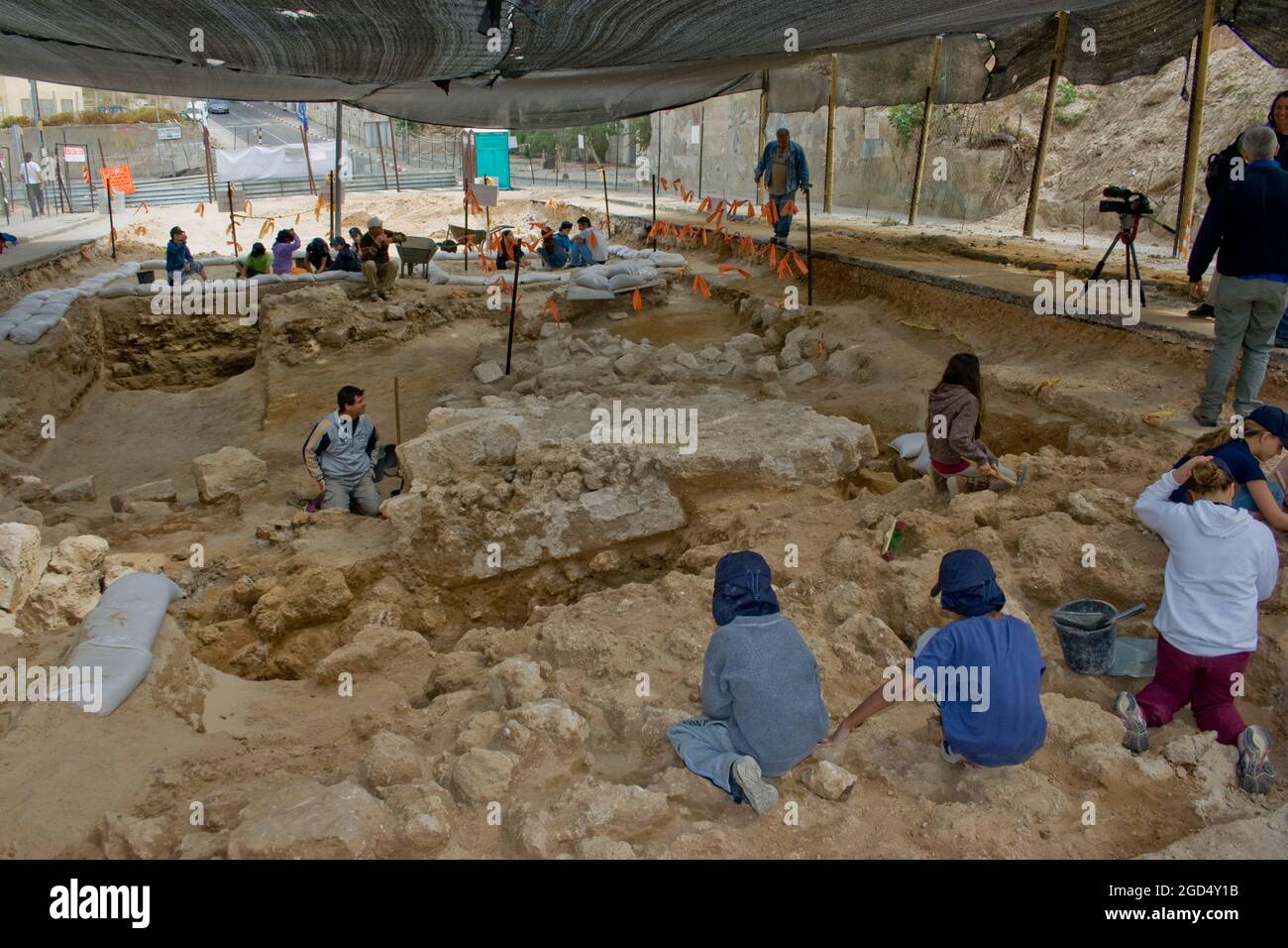 Volunteers and archaeologists at an archaeological excavation site in ...