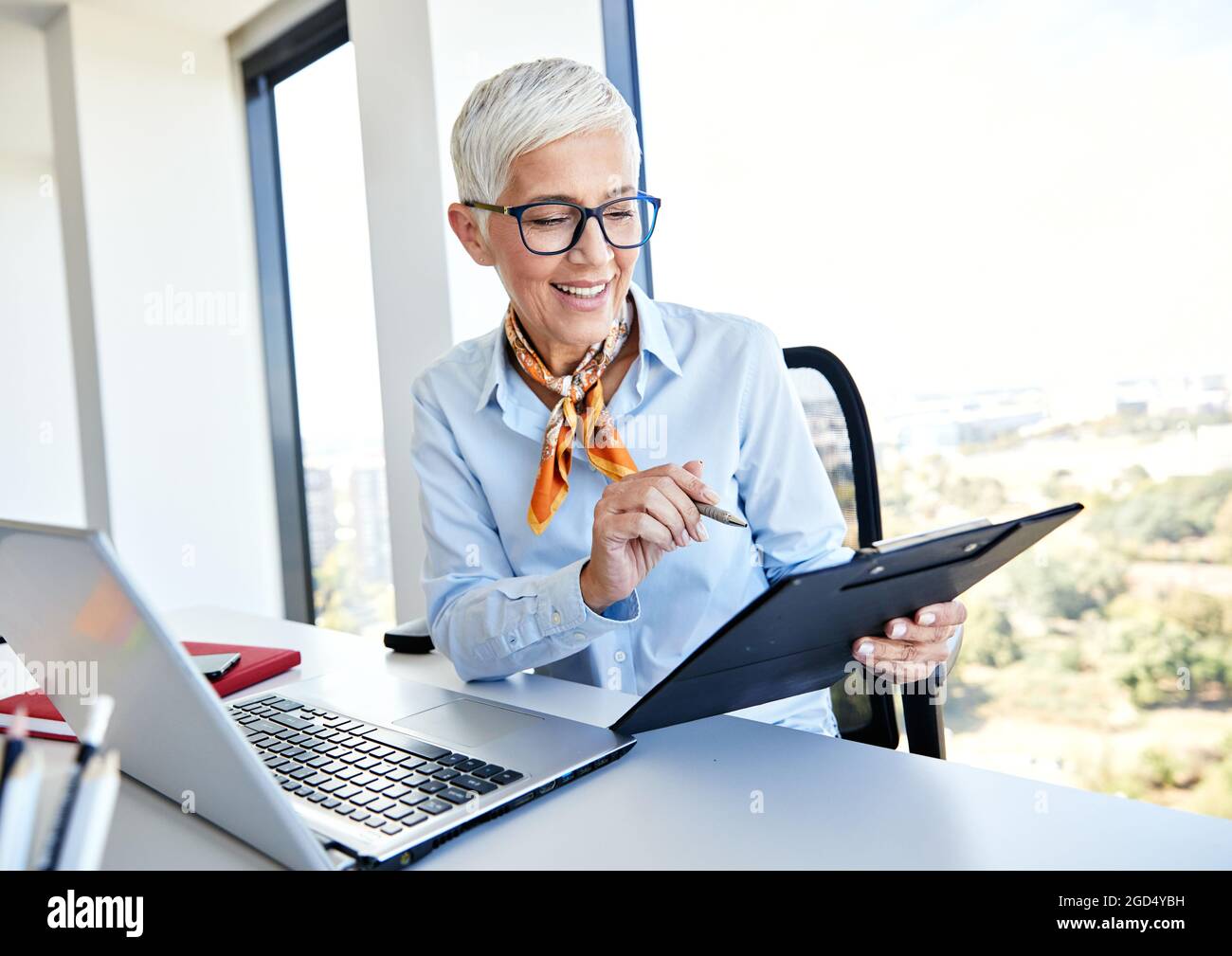 Portrait happy caucasian woman using hi-res stock photography and ...