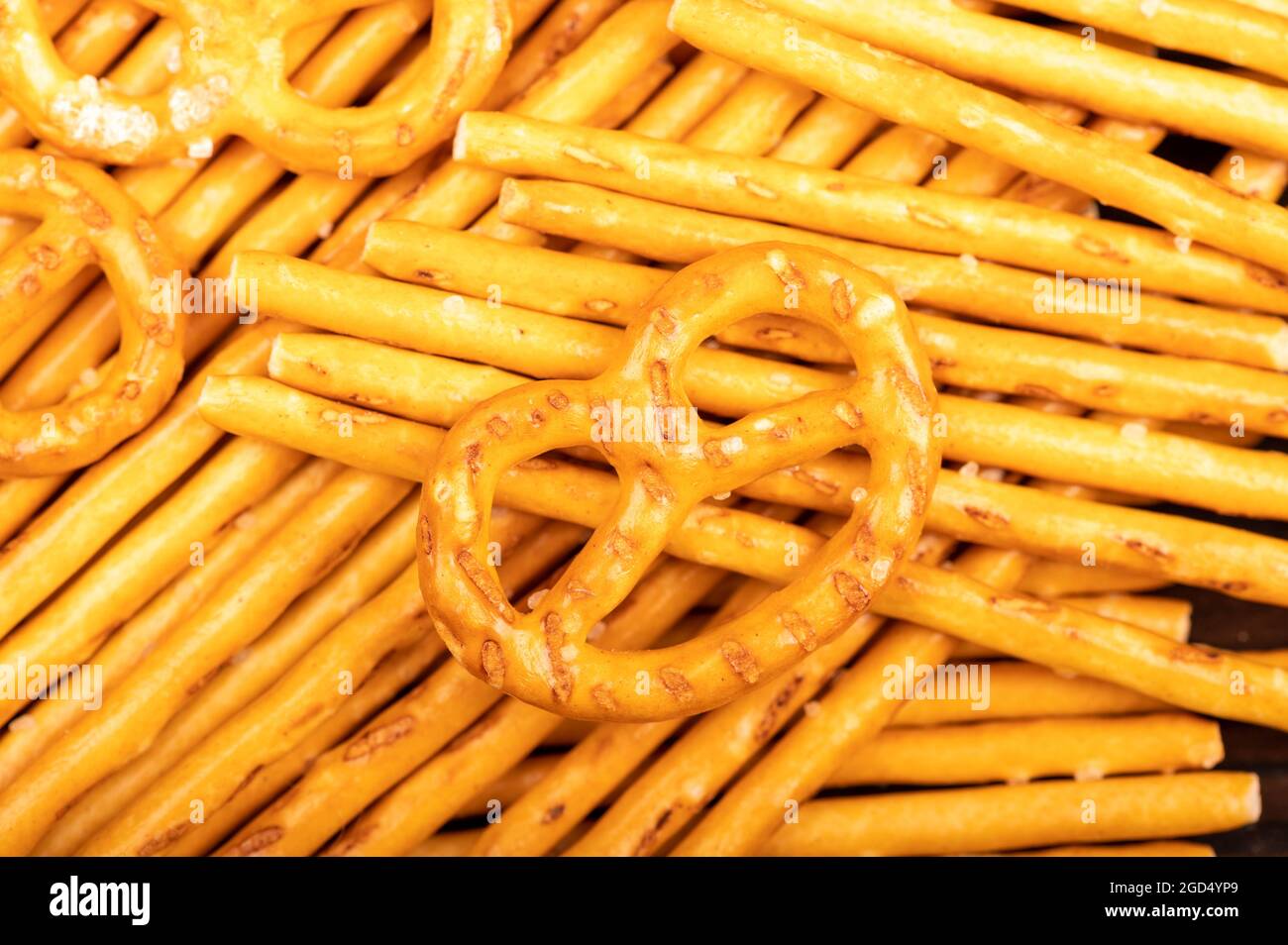 Bread sticks and bread figures with salt. Close-up Background image ...