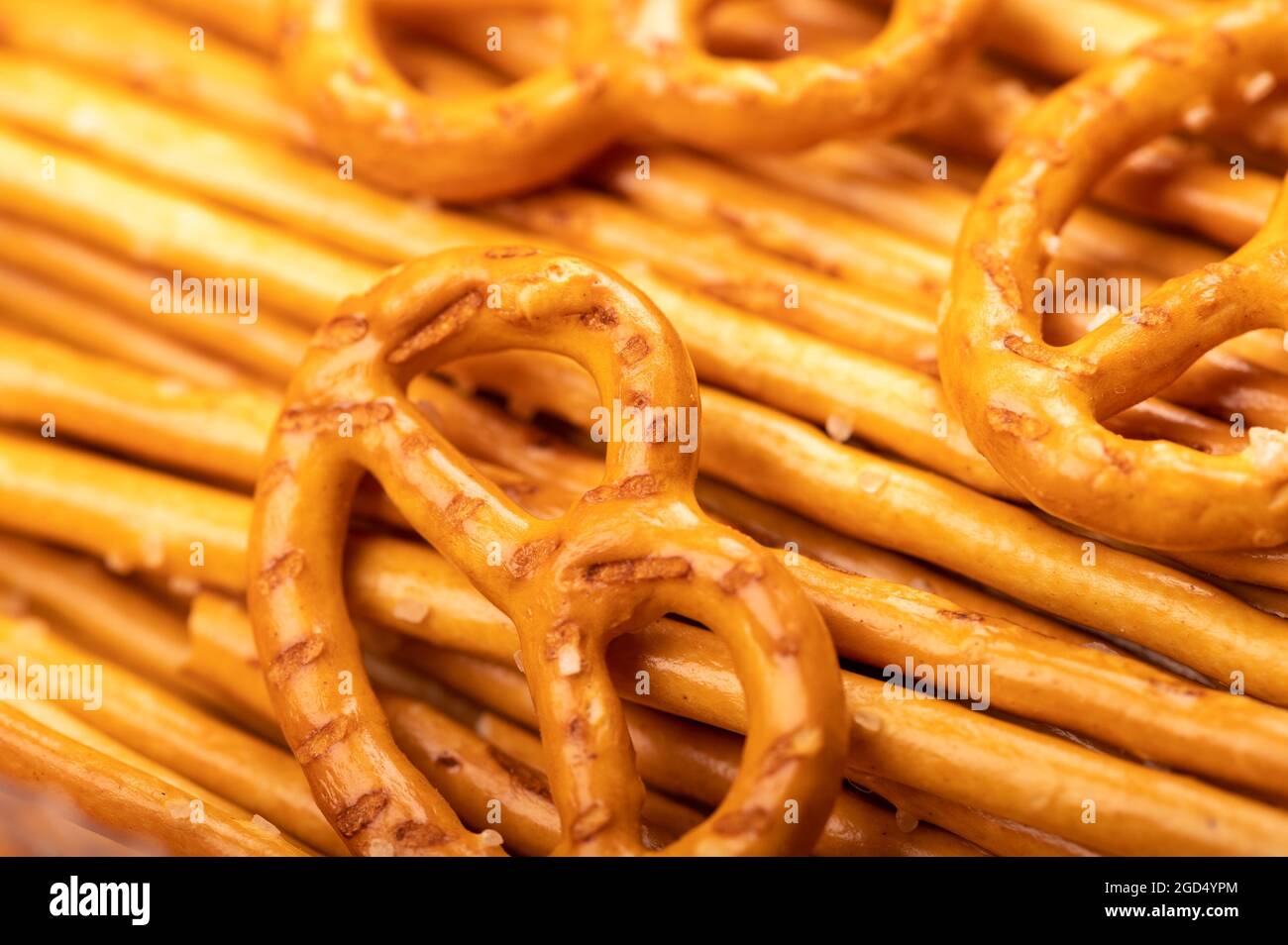 Bread sticks and bread figures with salt. Close-up Background image ...