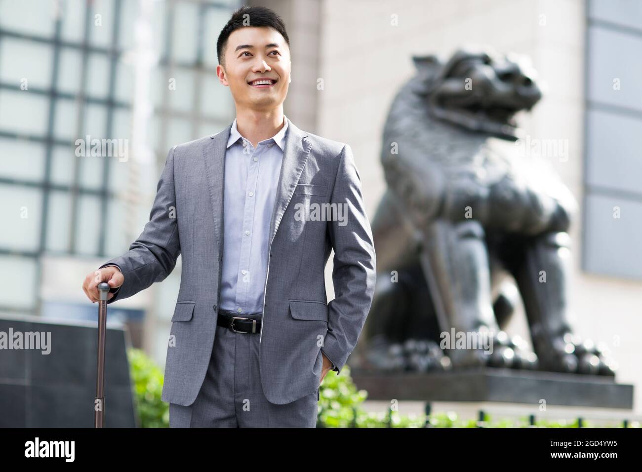 Indian man standing outside the bank hi-res stock photography and ...