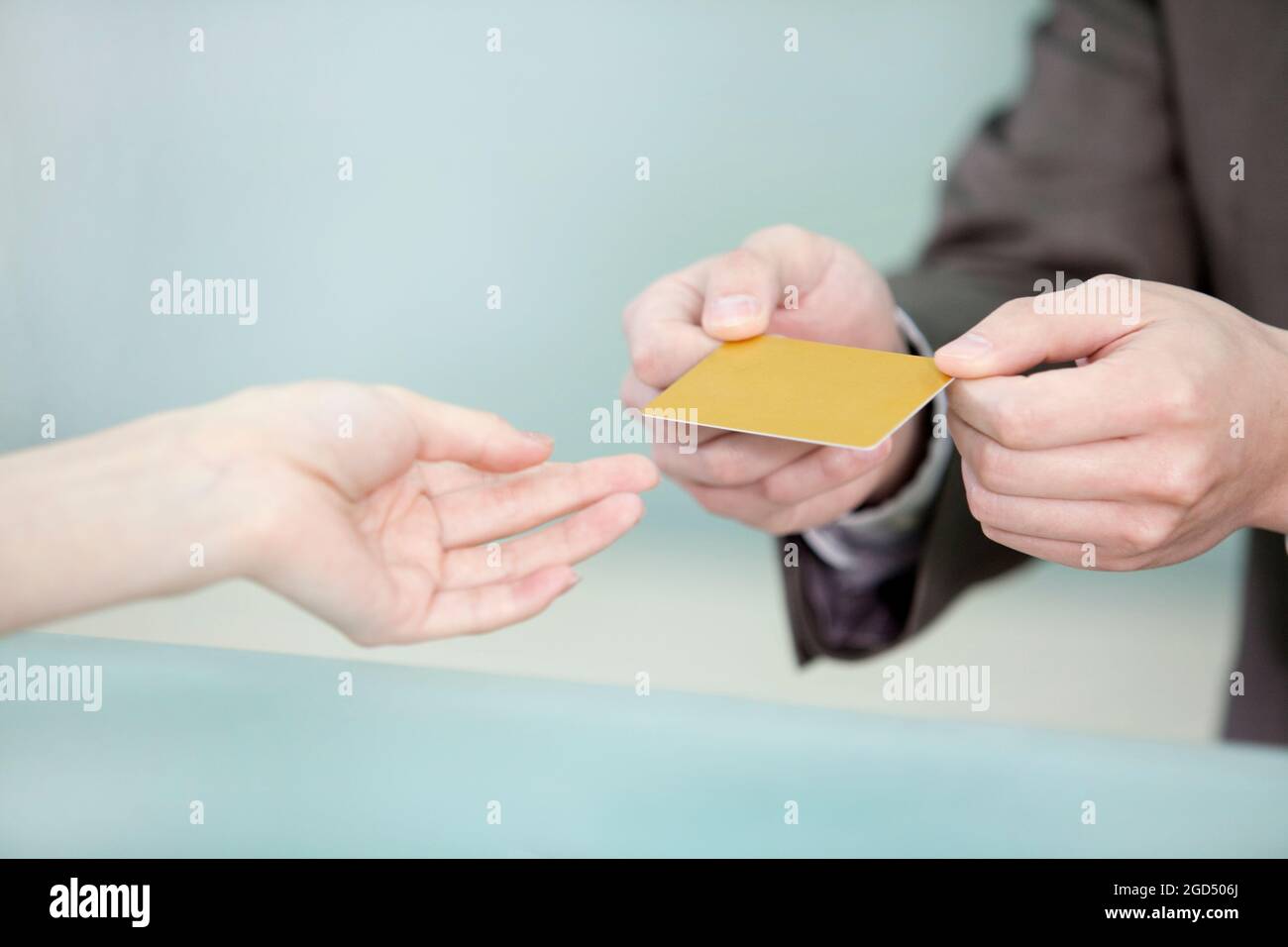 Handing over business card hi-res stock photography and images - Alamy