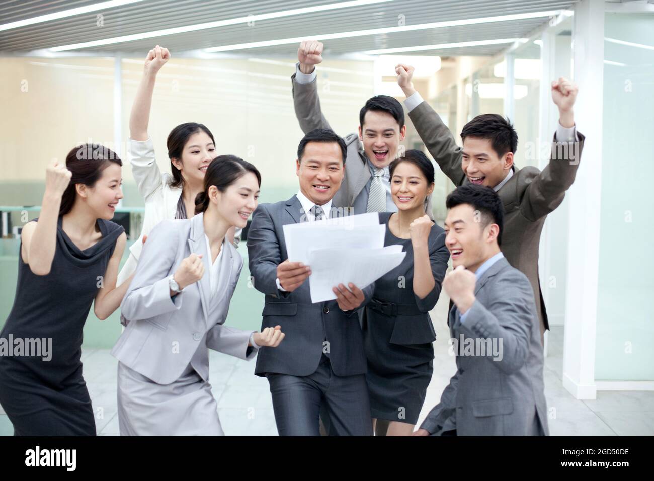 Business team celebrating with excitement Stock Photo - Alamy