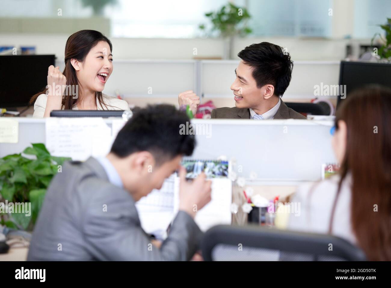 Cheerful office workers celebrating Stock Photo - Alamy