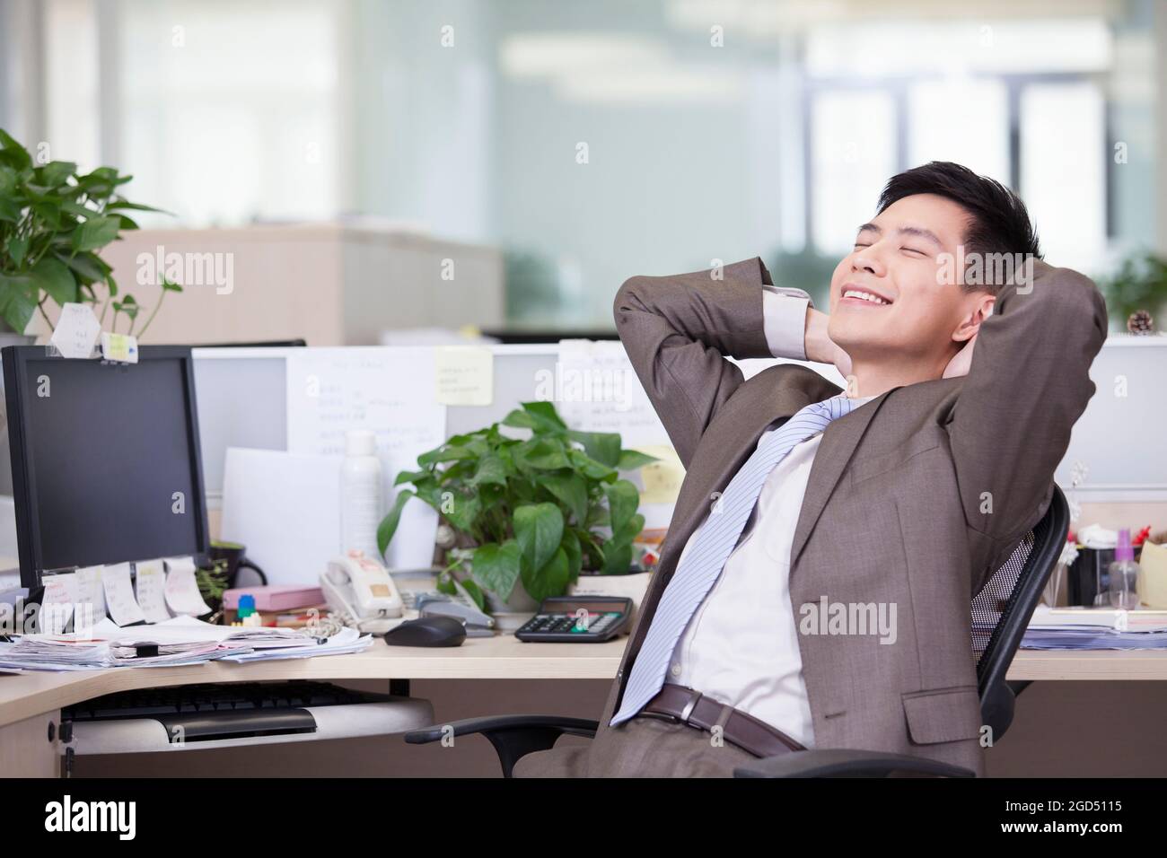 Indian man relaxing on chair hi-res stock photography and images - Alamy