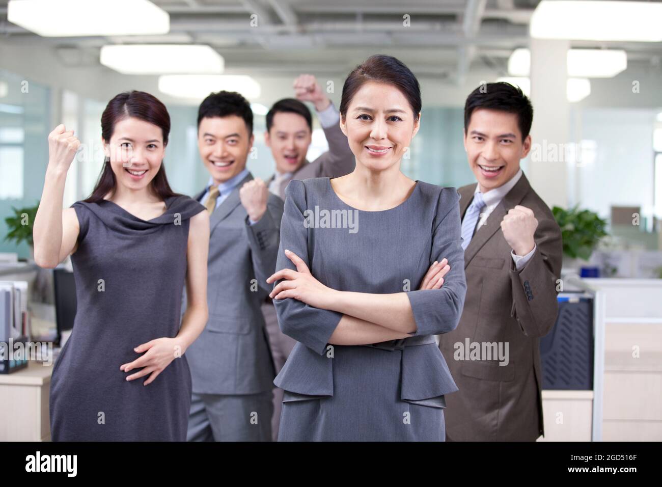 Excited business team celebrating Stock Photo - Alamy