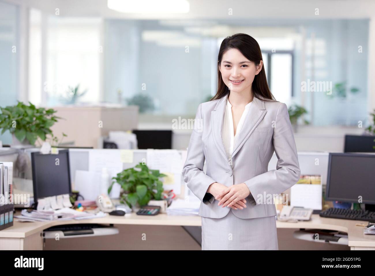 Portrait of smiling office lady Stock Photo - Alamy