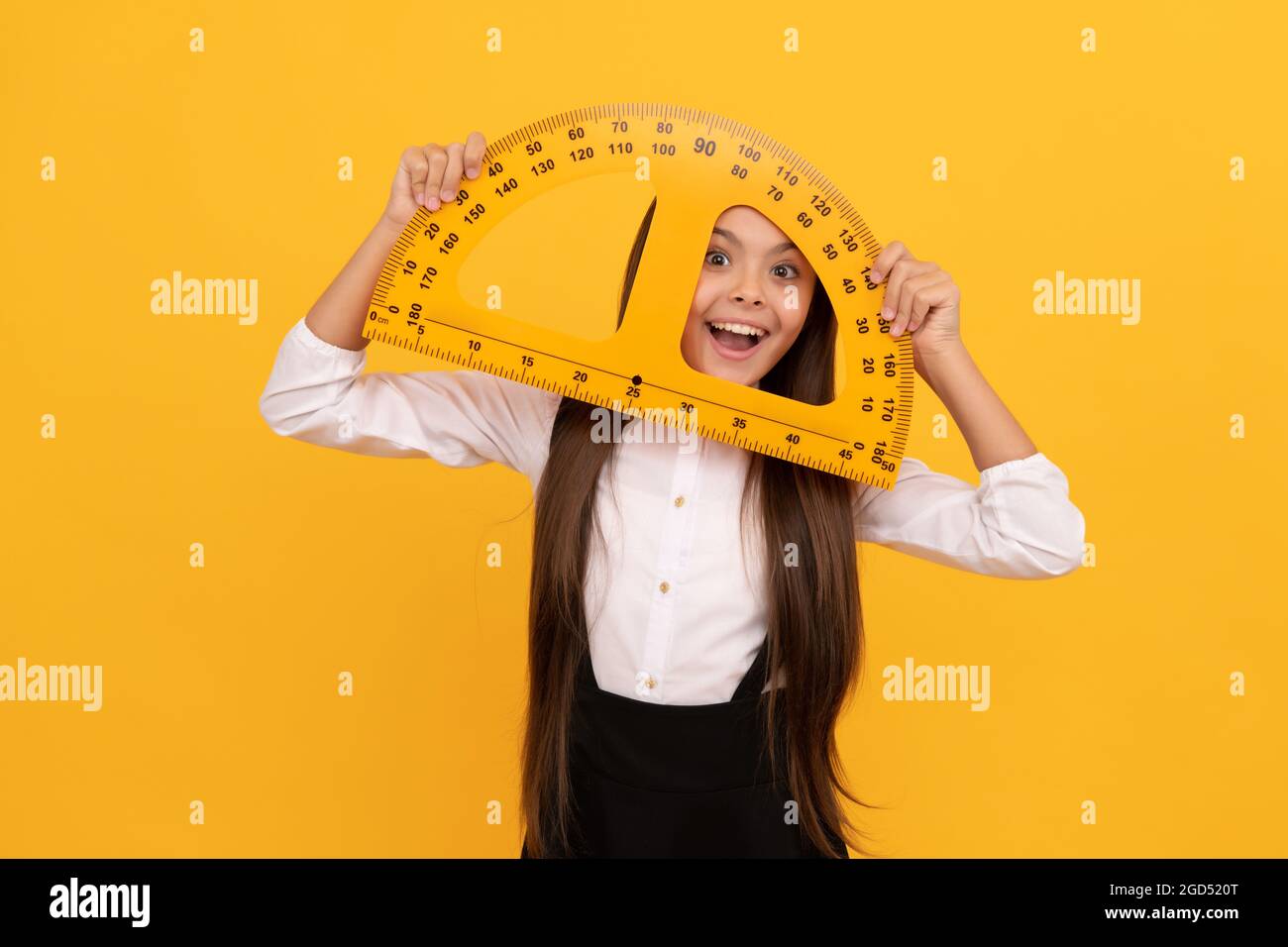 education for child. mathematics. cheerful teen girl hold protractor ...