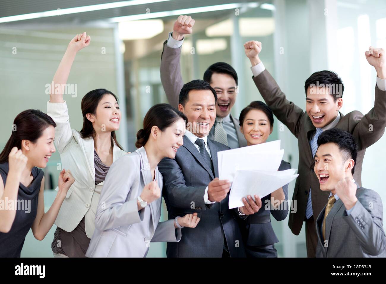 Business team celebrating with excitement Stock Photo - Alamy