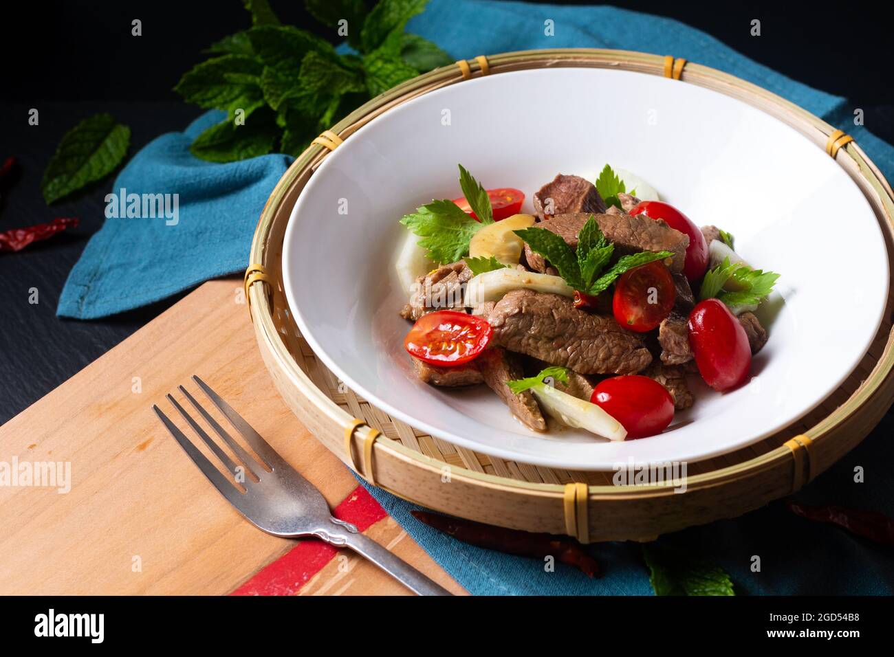 Food concept Thai spicy beef salad Yum Nua yang on wooden board with ...