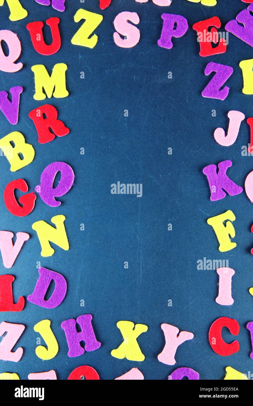 English alphabet on school desk background Stock Photo - Alamy